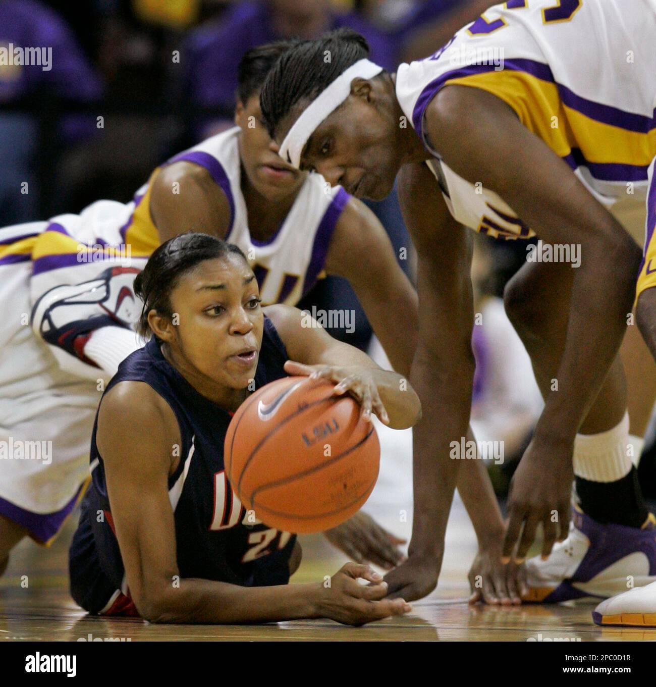 Connecticut guard Renee Montgomery, bottom left, gets the loose ball as ...