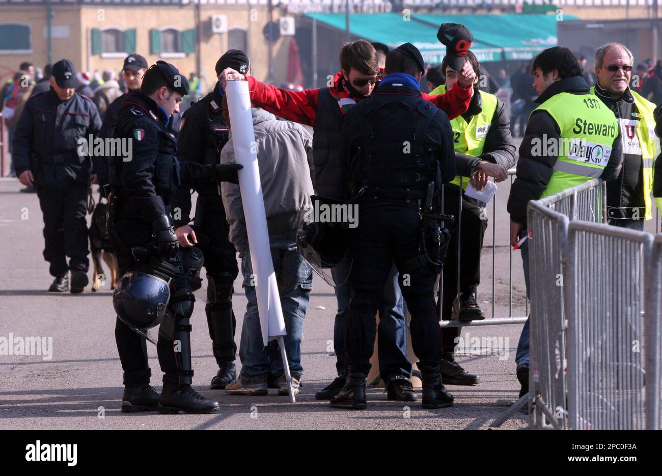 Italian Carabinieri inspect AC Milan's supporters prior to the start of ...