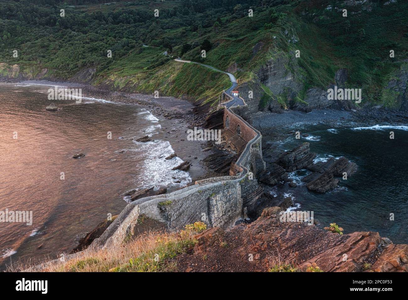 Stairs on stone bridge in San juan de Gaztelugatxe island at sunrise ...