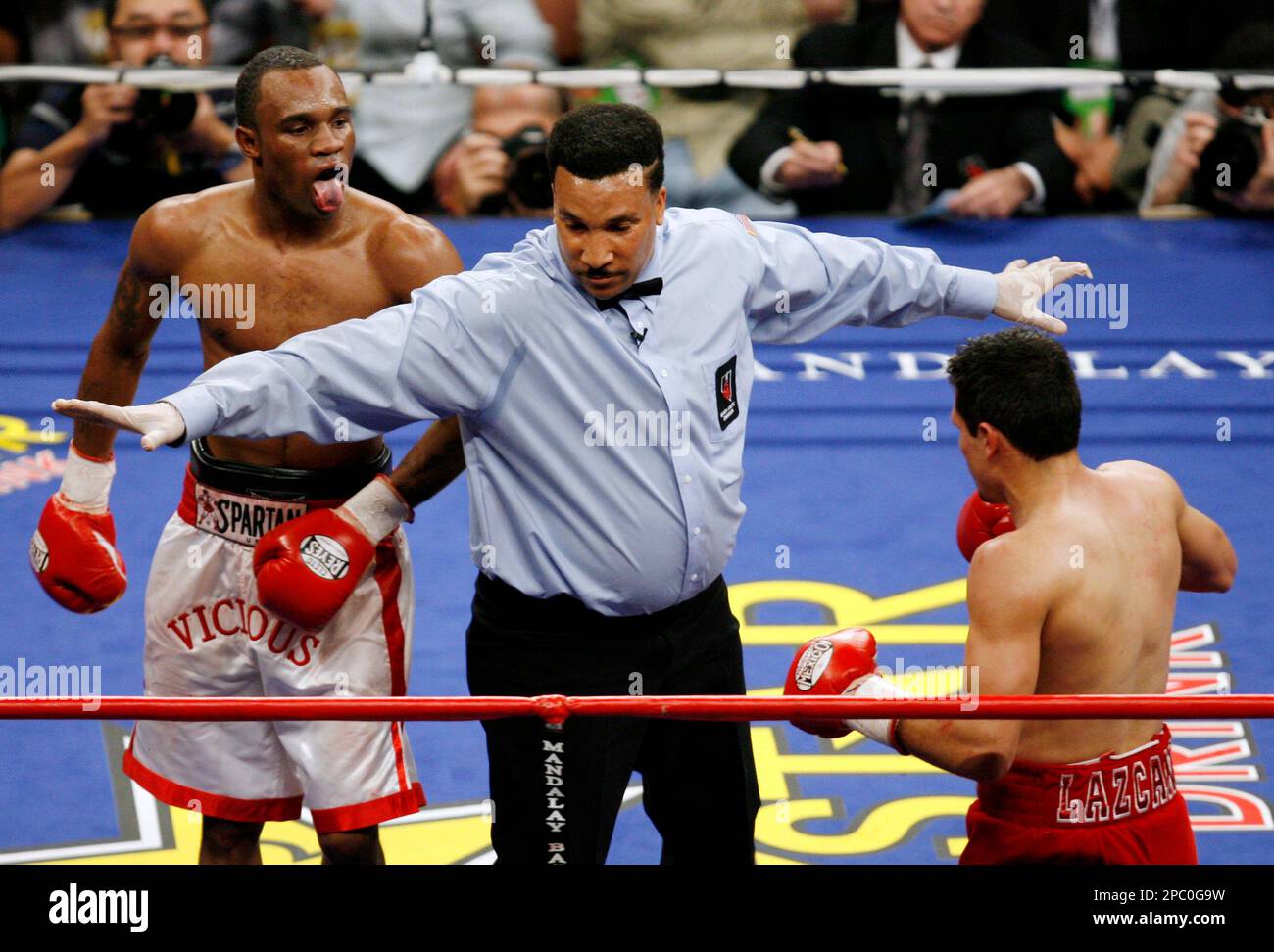 Vivian Harris, left, sticks out his tongue and Juan Lazcano stands at right following their WBC ...