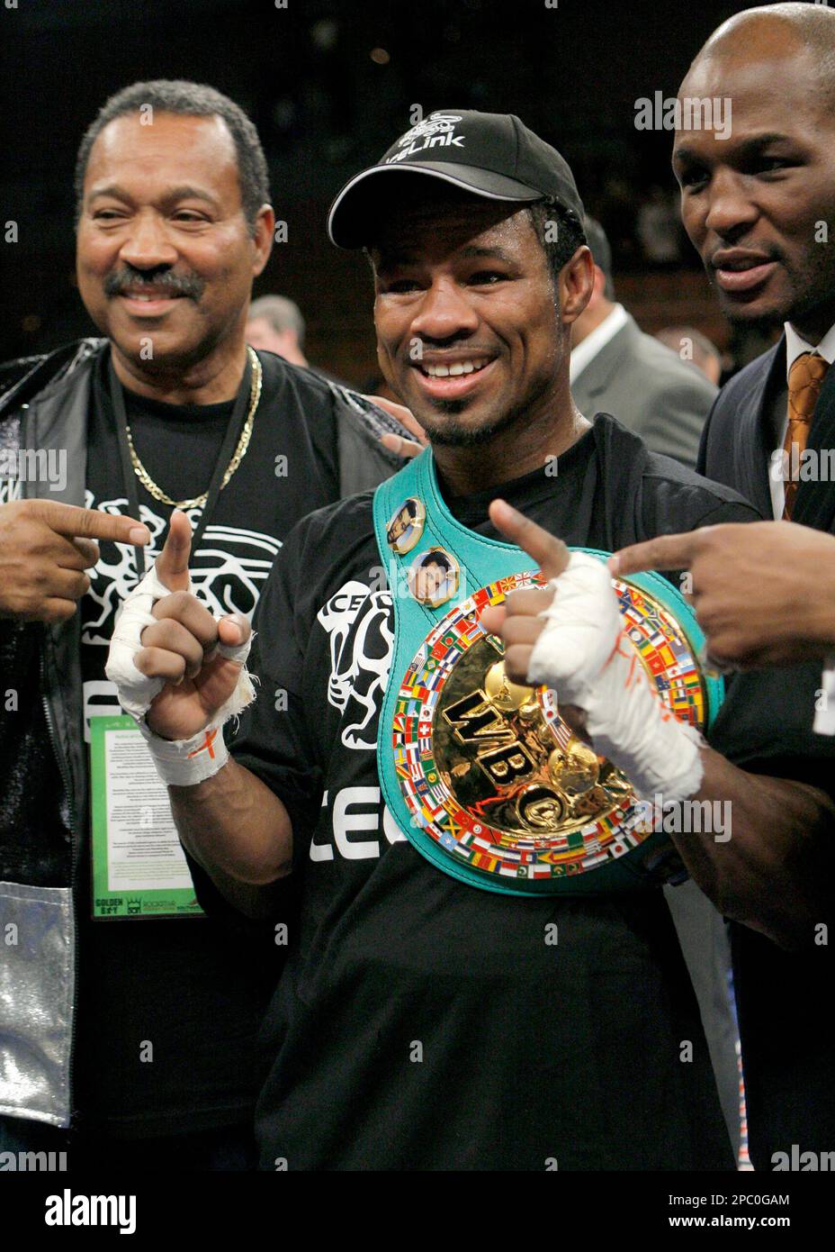 Shane Mosley, center, poses with his father Jack, left, and Bernard ...