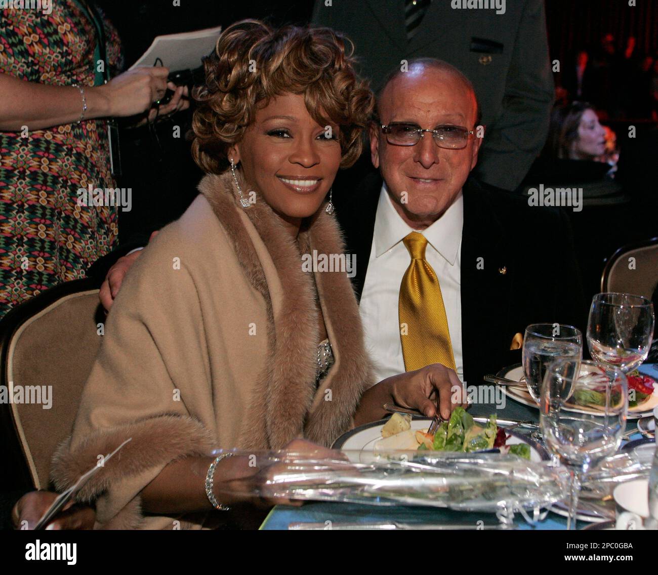 Whitney Houston, left, and producer Clive Davis pose inside the Clive ...