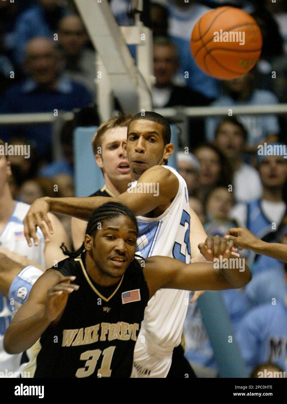 North Carolina's Brandan Wright, top, and Wake Forest's Jamie Skeen (31 ...