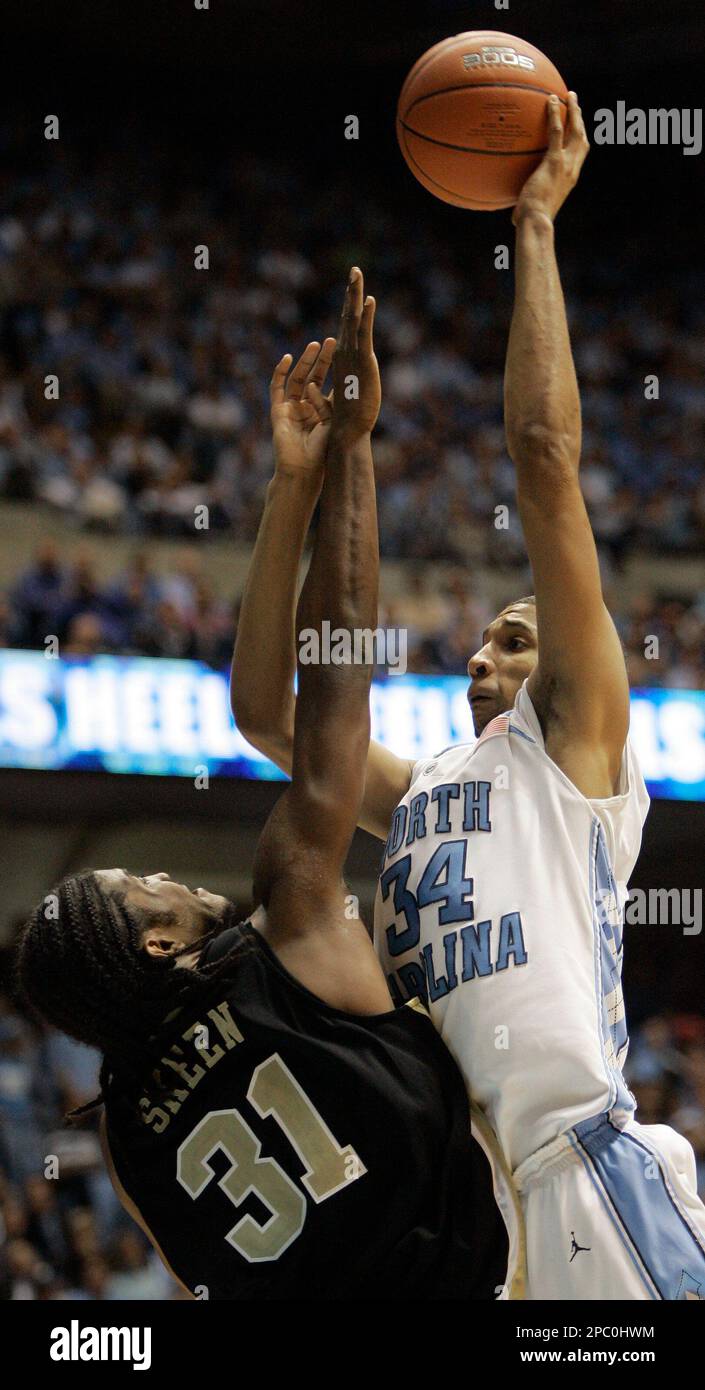 North Carolina's Brandan Wright (34) shoots over Wake Forest's Jamie ...