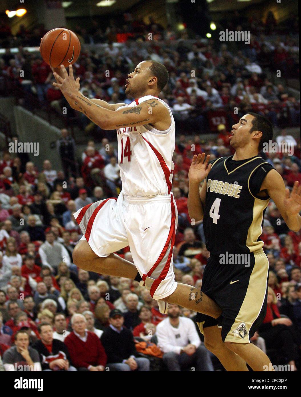 Ohio State's Jamar Butler (14) goes to the basket for two as Purdue's ...