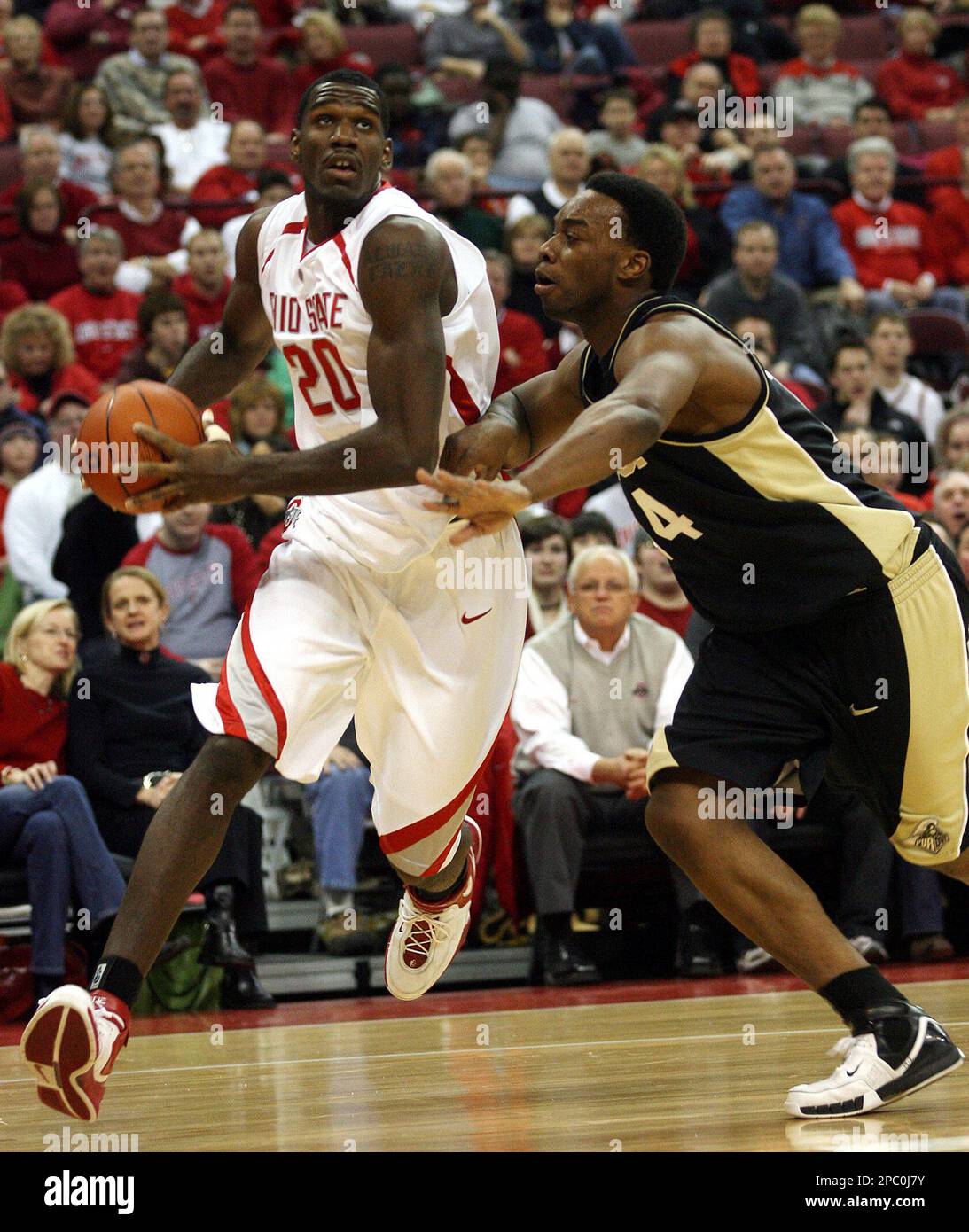 Ohio State's Greg Oden (20) drives to the basket as Purdue's Carl ...