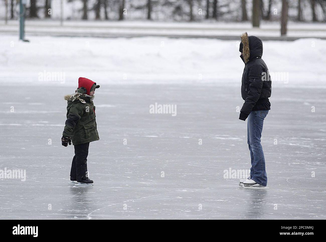 Cameron Incze, 5, skates toward his mother, Jennifer, on Hodges Pond in ...