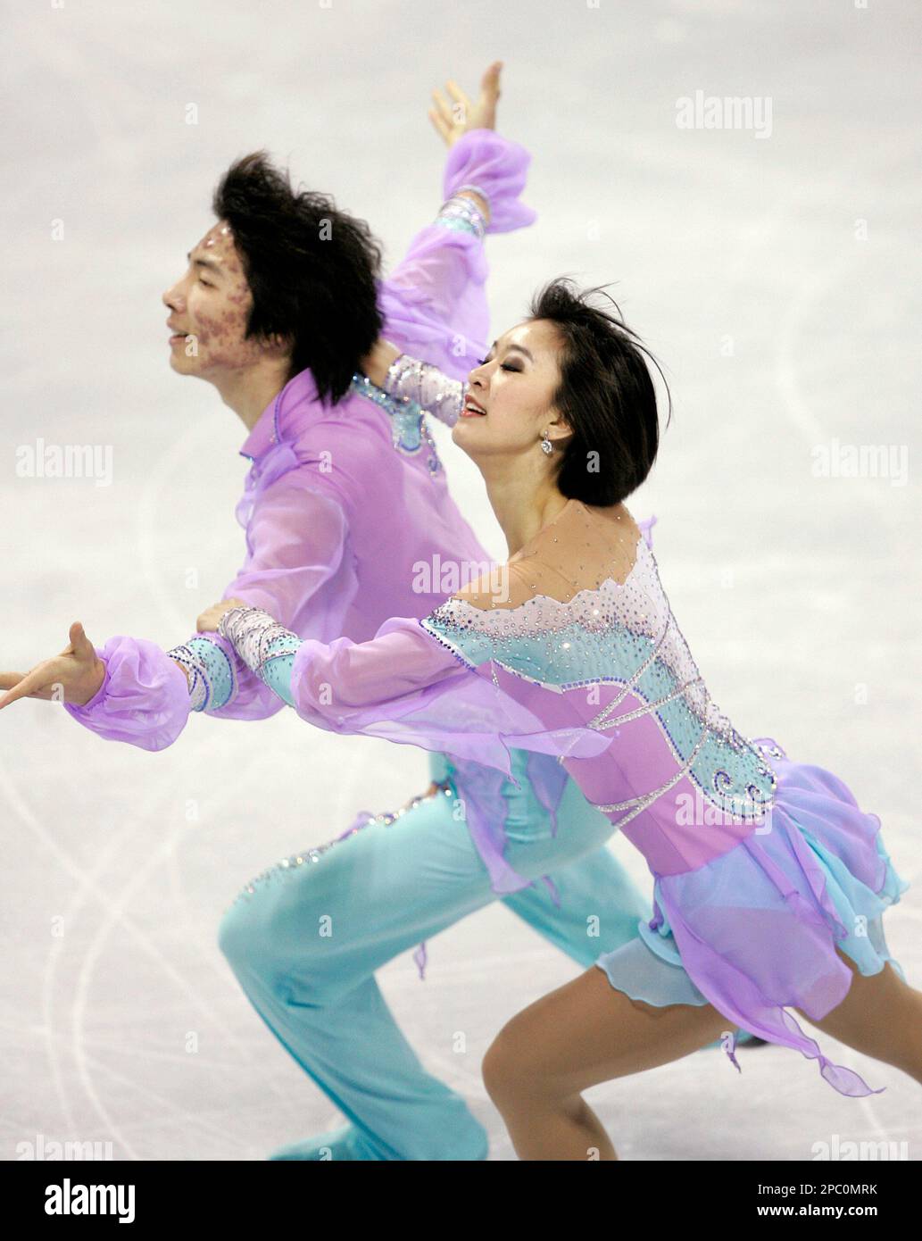 Huang Xintong, right, and Zheng Xun, of China, skate in the ice dancing ...