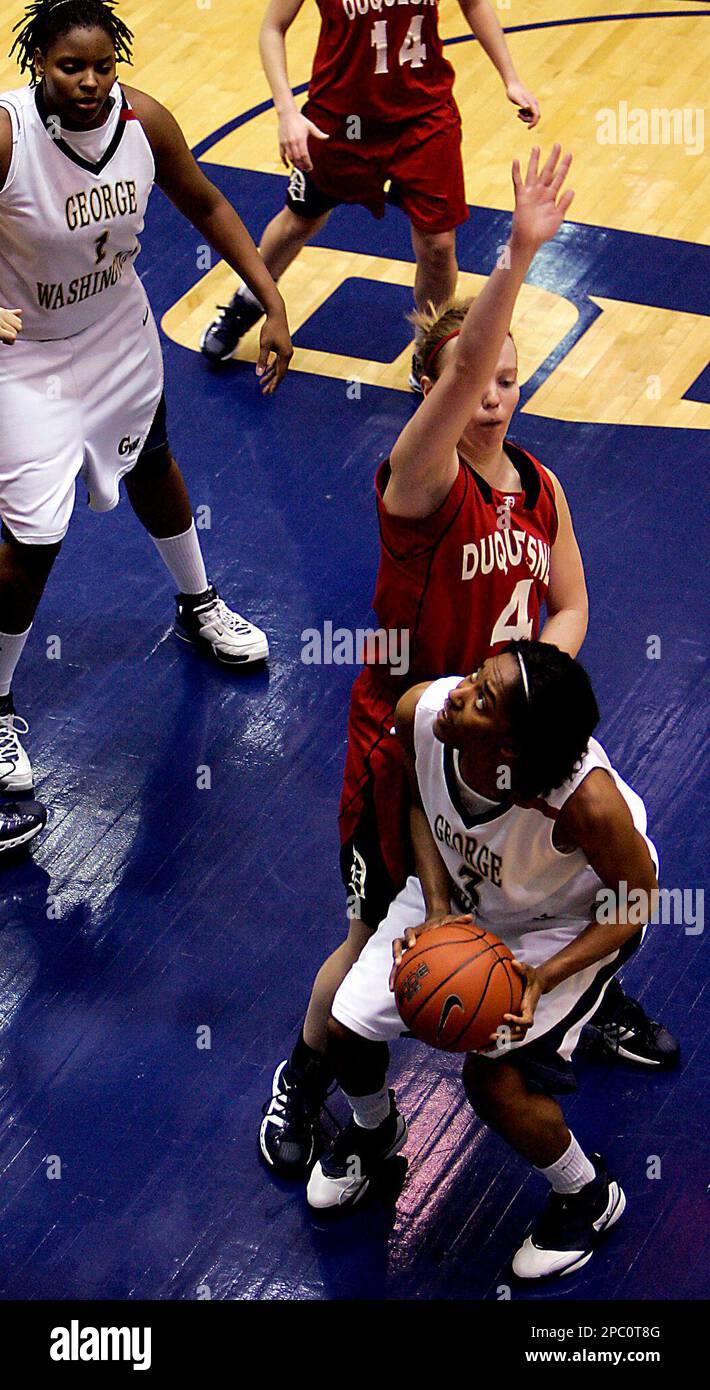 Duquesne's Rachel Clancy (4) defends against George Washington's ...