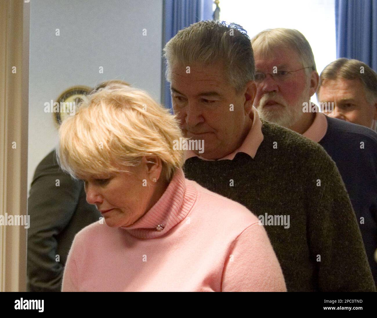 Linda Walker, Sid Walker and Allen Sjodin, from left, walk into a news ...