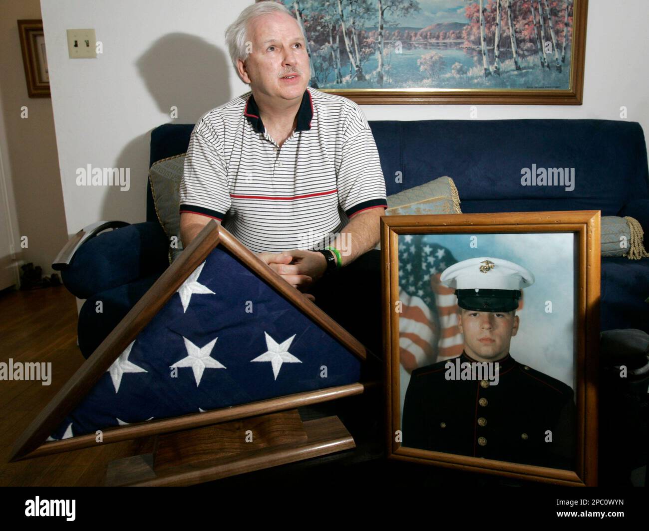 **ADVANCE FOR SATURDAY, FEB. 10** John Fenton sits in his living room ...