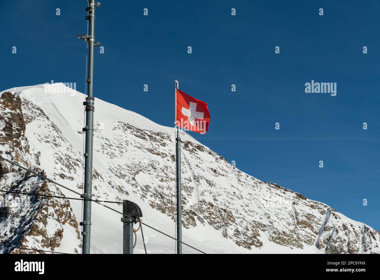 Jungfraujoch, Canton Bern, Switzerland, February 11, 2023 Waving swiss ...
