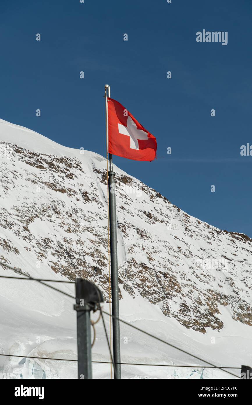 Jungfraujoch, Canton Bern, Switzerland, February 11, 2023 Waving swiss ...