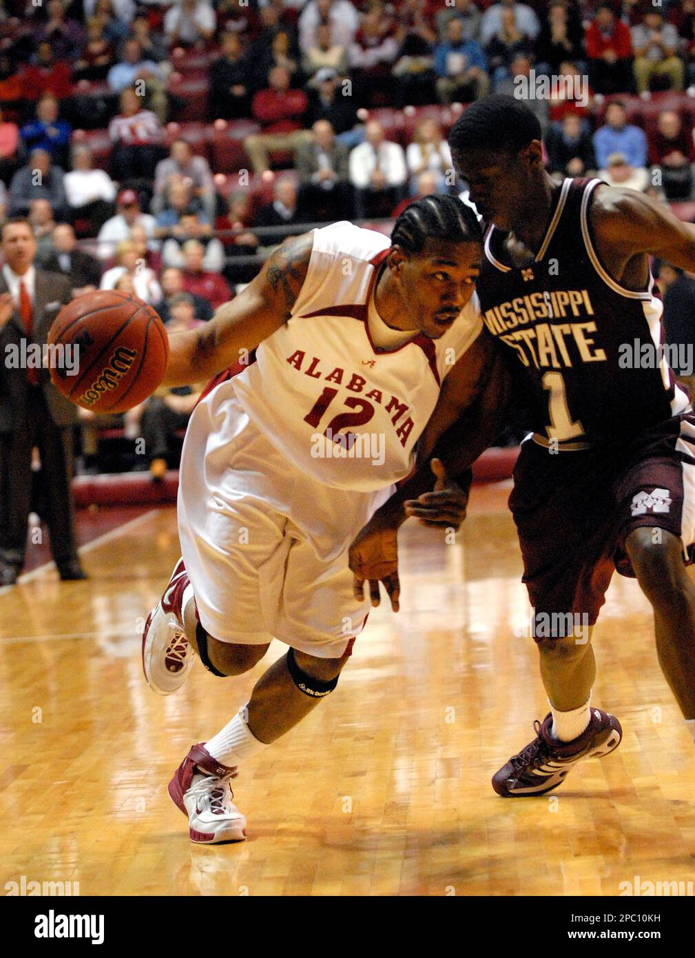 Alabama's Alonzo Gee (12) drives past Mississippi State defender ...