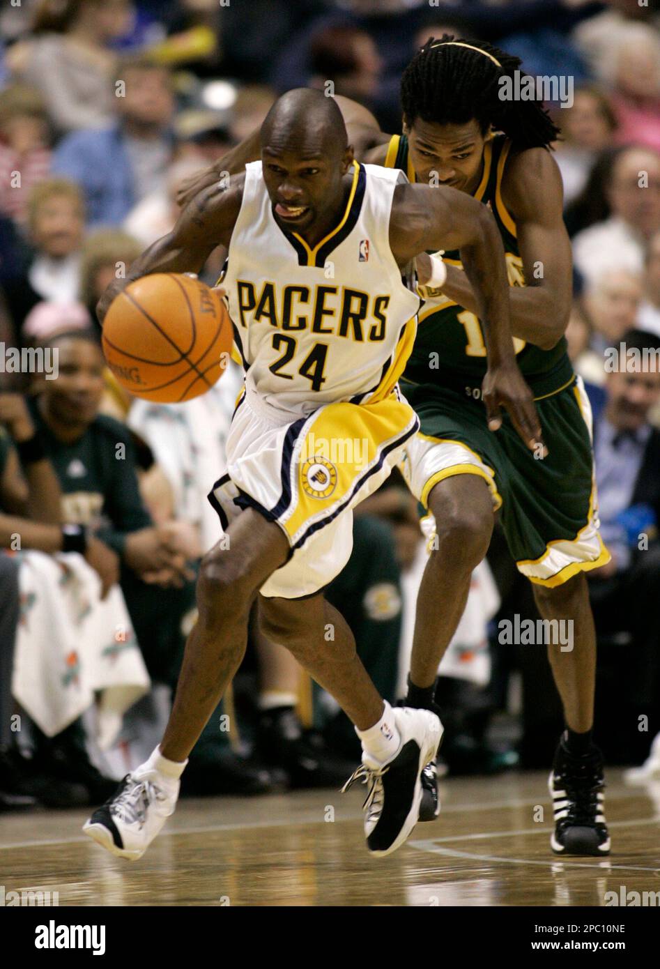 Indiana Pacers guard Darrell Armstrong, left, outruns Seattle ...