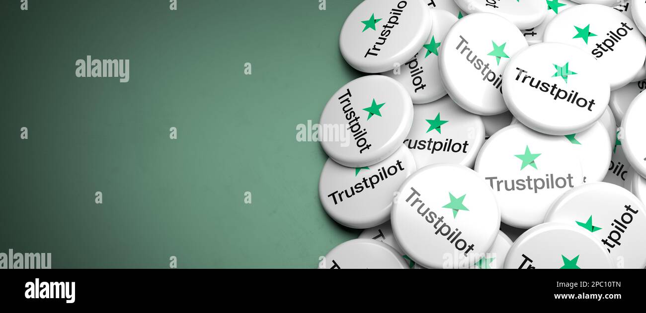 Logos of Trustpilot the business review website on a heap on a table ...