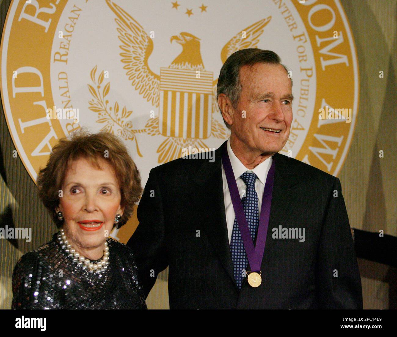 Former first lady Nancy Reagan and former President George H.W. Bush ...