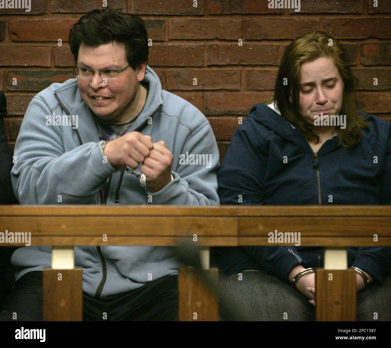 Michael Riley, 34, and his wife, Carolyn Riley, 32, are shown in ...