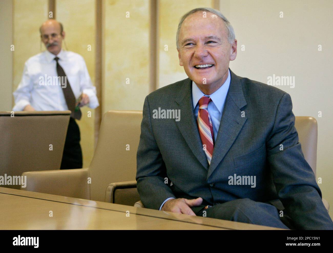 Former Massachusetts Attorney General Tom Reilly, right, reacts when ...
