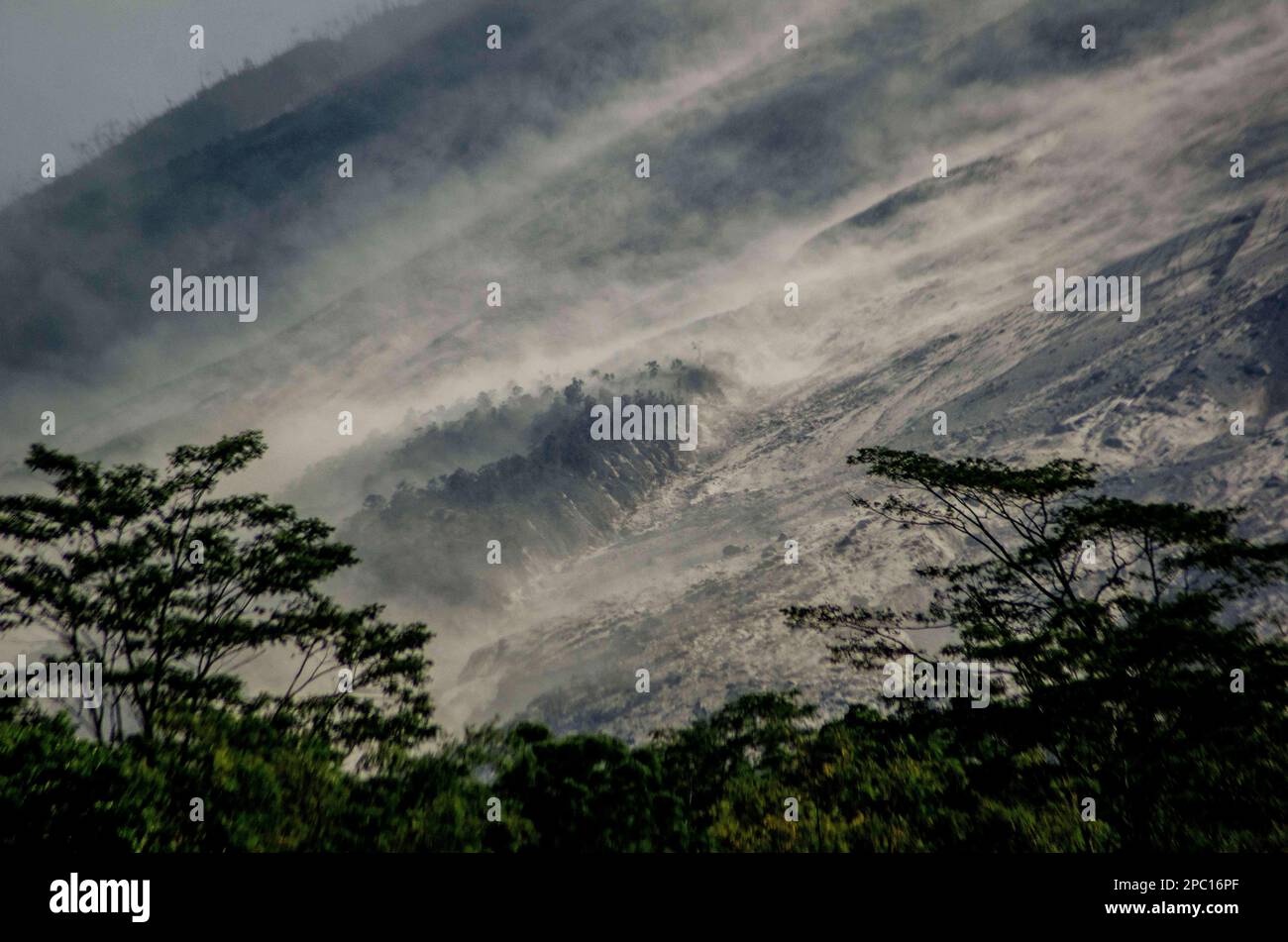 Yogyakarta, Indonesia. 13th Mar, 2023. Volcanic materials spew from ...