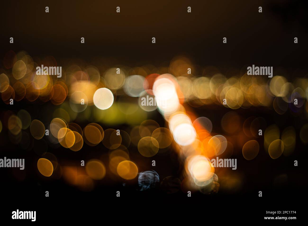 Abstract bokeh balls of highlights created by car traffic lights at ...