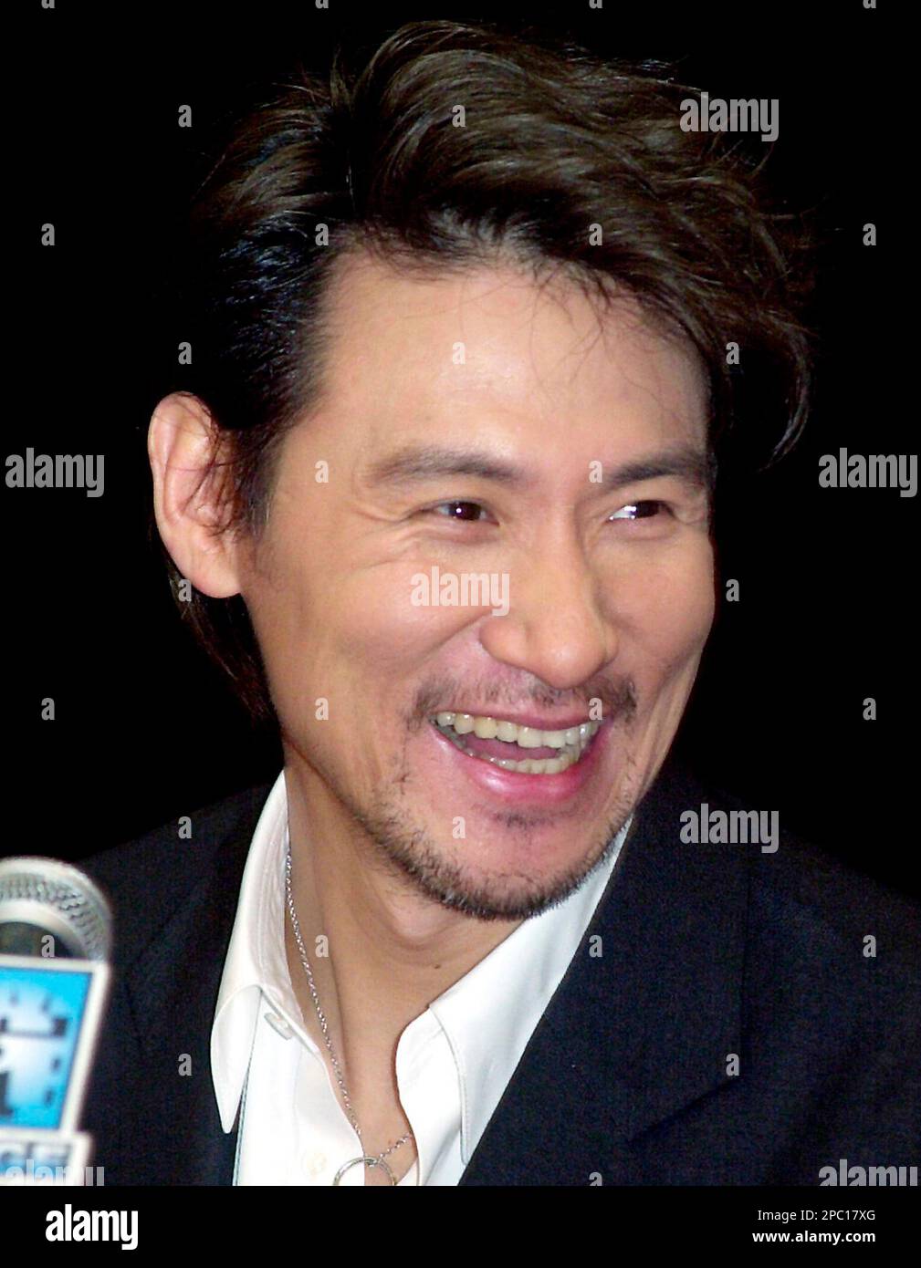 ** FILE ** Hong Kong singer Jacky Cheung poses for photographers during ...