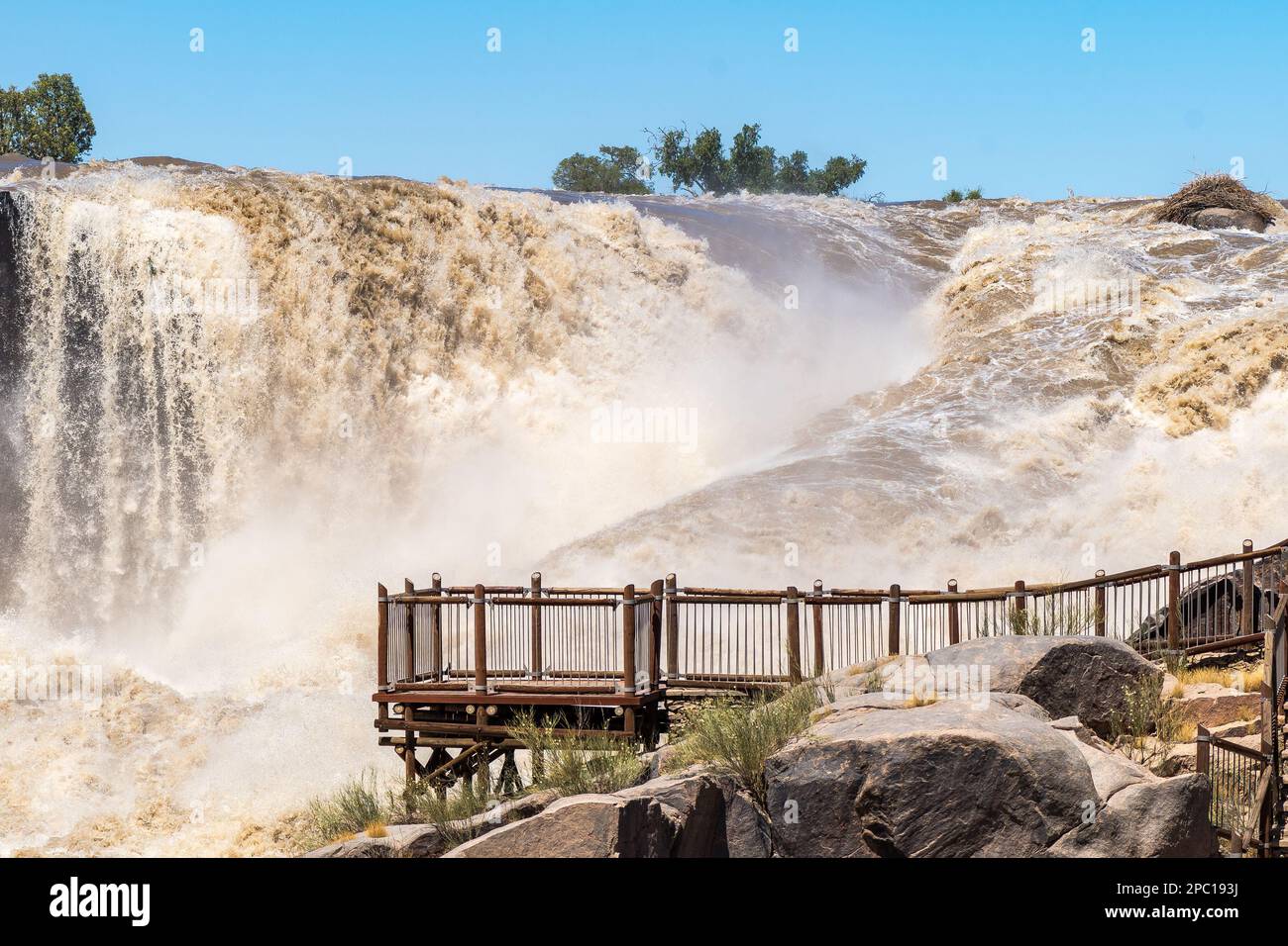 A viewpoint at the main Augrabies waterfall in the flooded Orange River ...