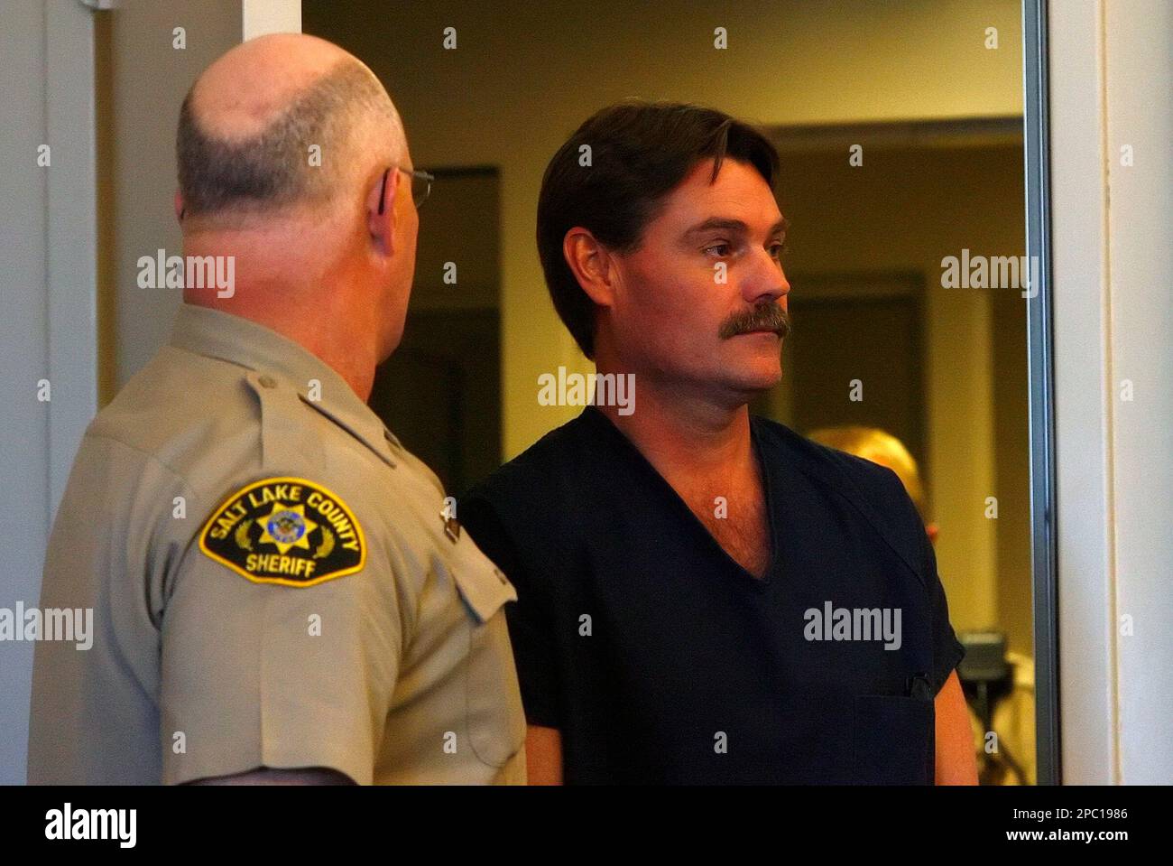 Dan Petersen, right, enters the courtroom for a hearing Monday morning ...