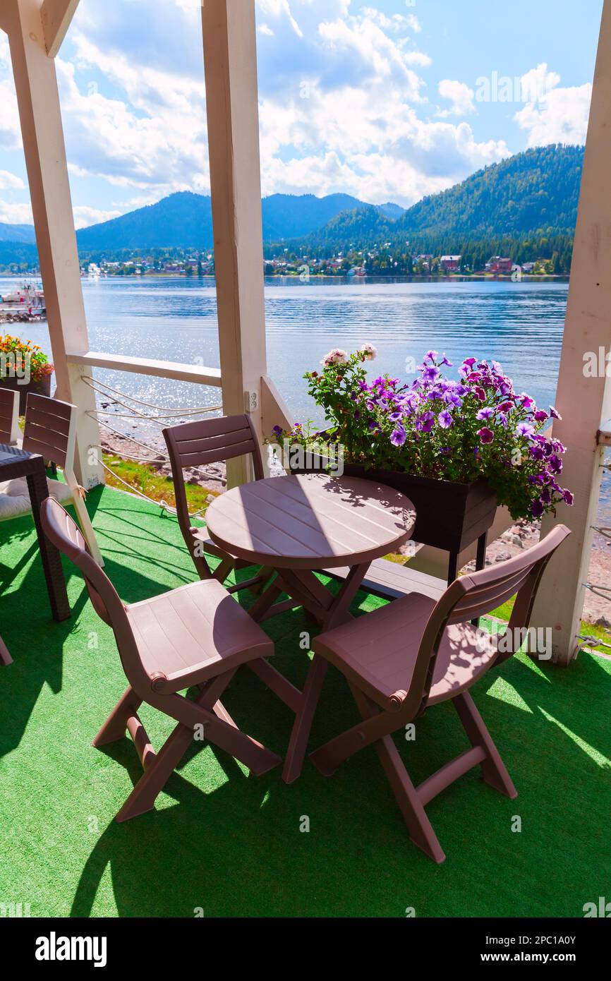 Summer terrace vertical photo with outdoor furniture on a sunny day ...