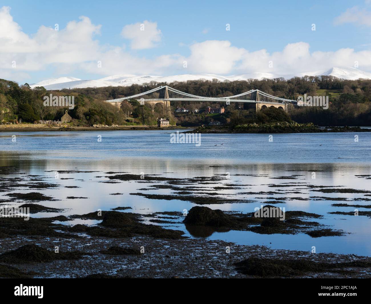 View across Menai Strait to Menai Bridge and Church Island with snow ...