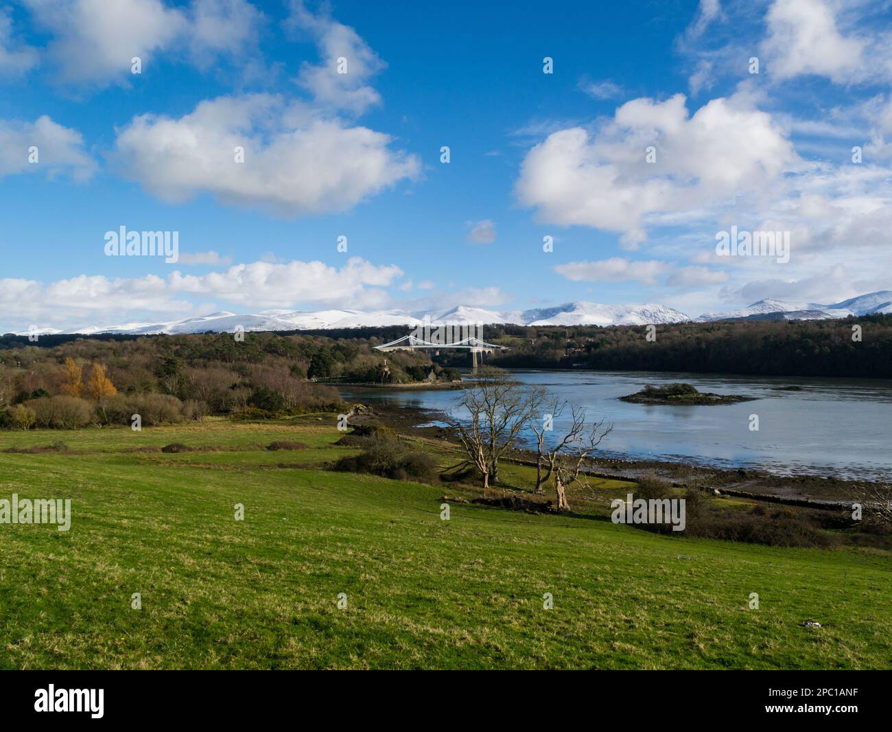 View across Menai Strait to Menai Bridge and Church Island with snow ...