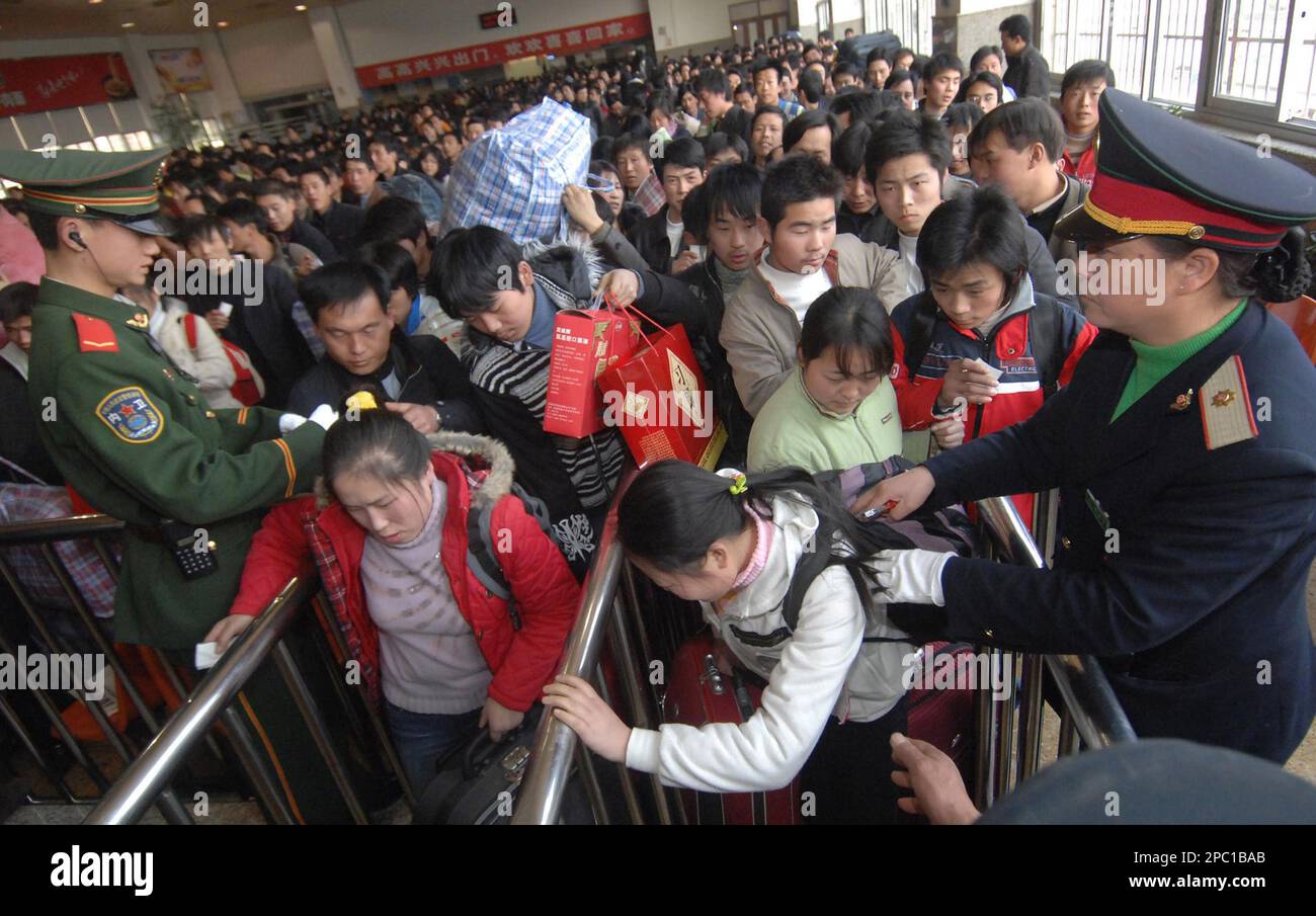 In this photo released by China's Xinhua news agency, passengers have ...