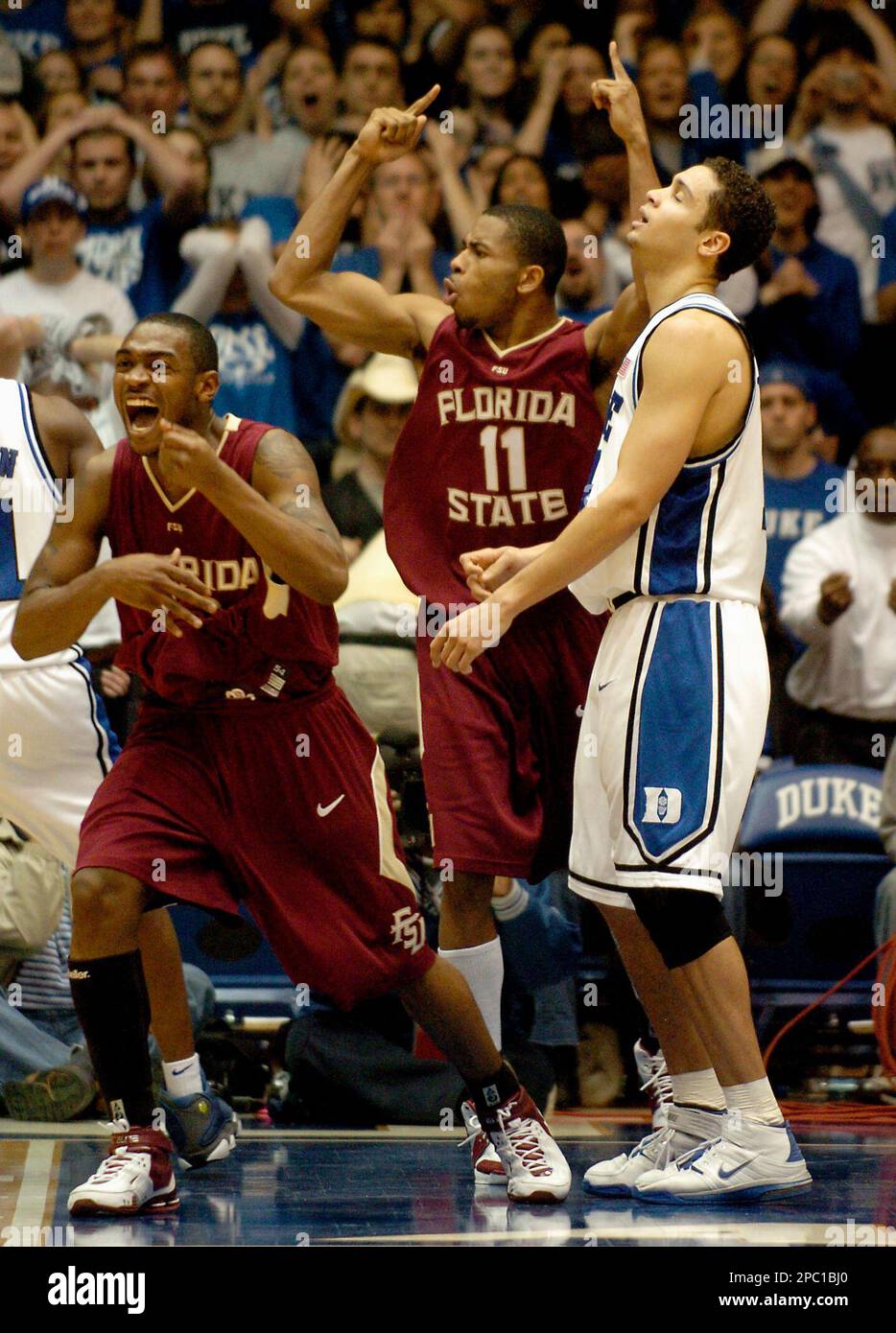 Duke's David McClure, right, reacts to being upset by Florida State, as ...