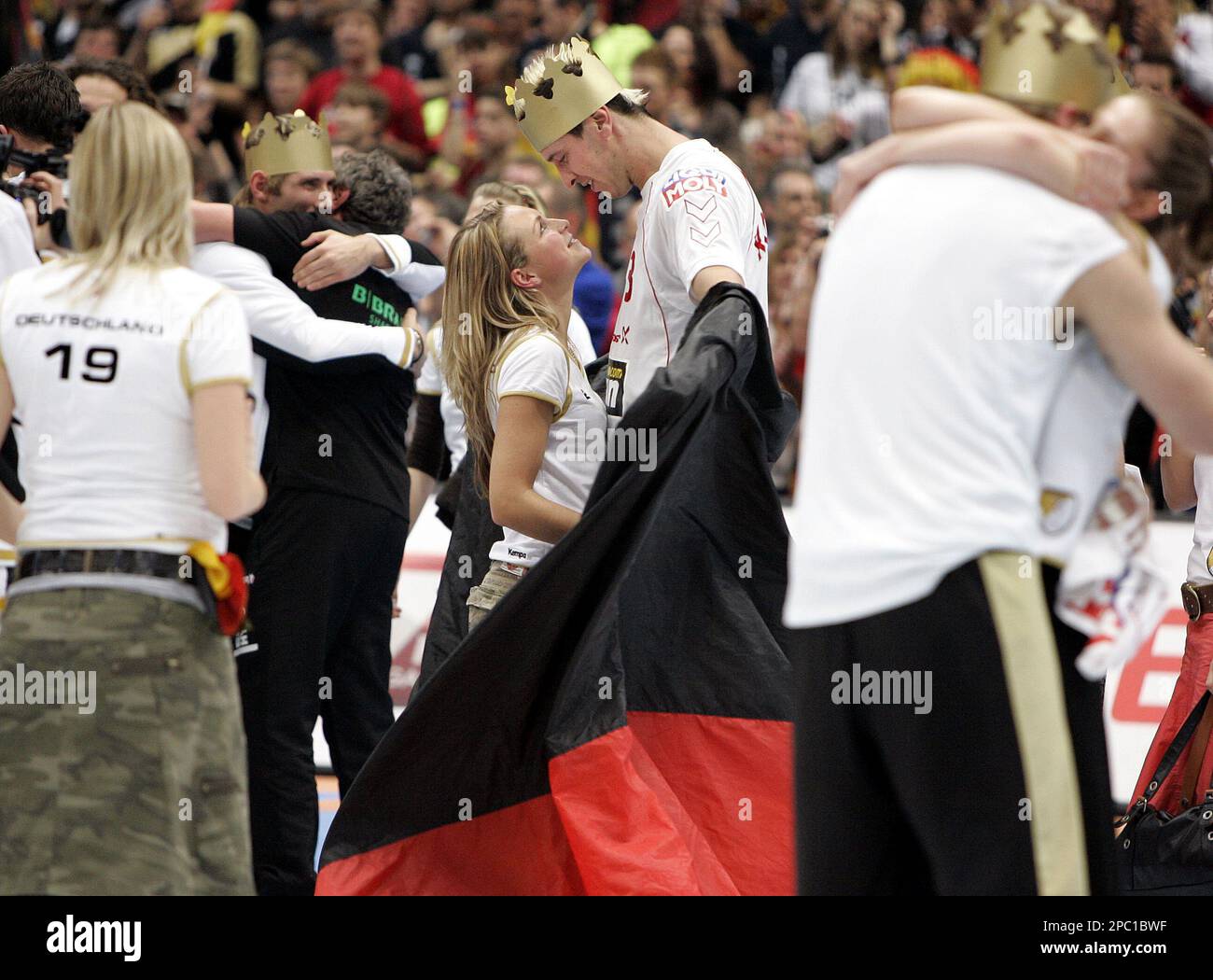 Germany's Pascal Hens, center, celebrates with his girlfriend Angela ...