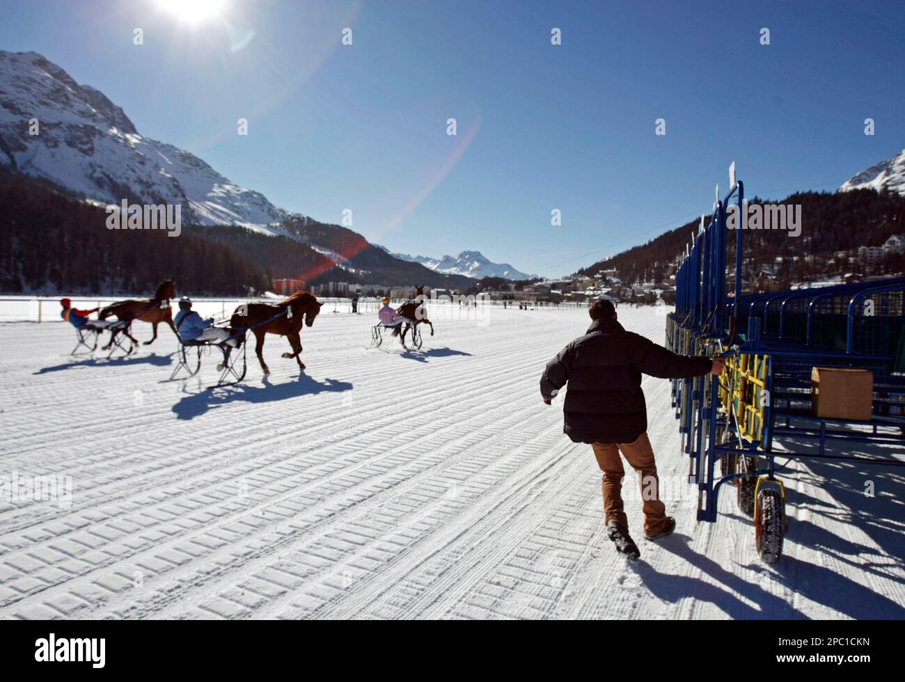 The starting machine is transported down the track, as the trotters ...