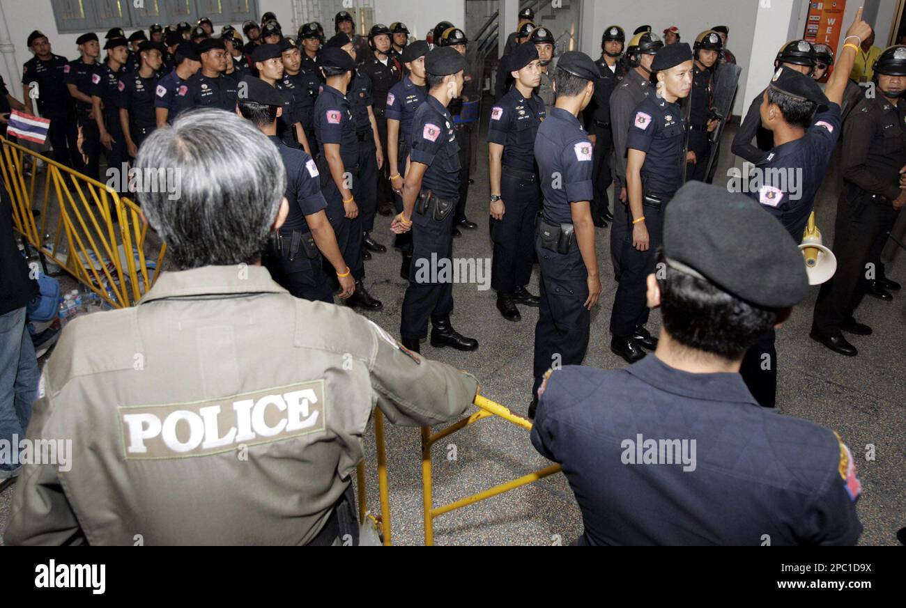 Thai police officers are briefed before being deployed at Supachalasai ...