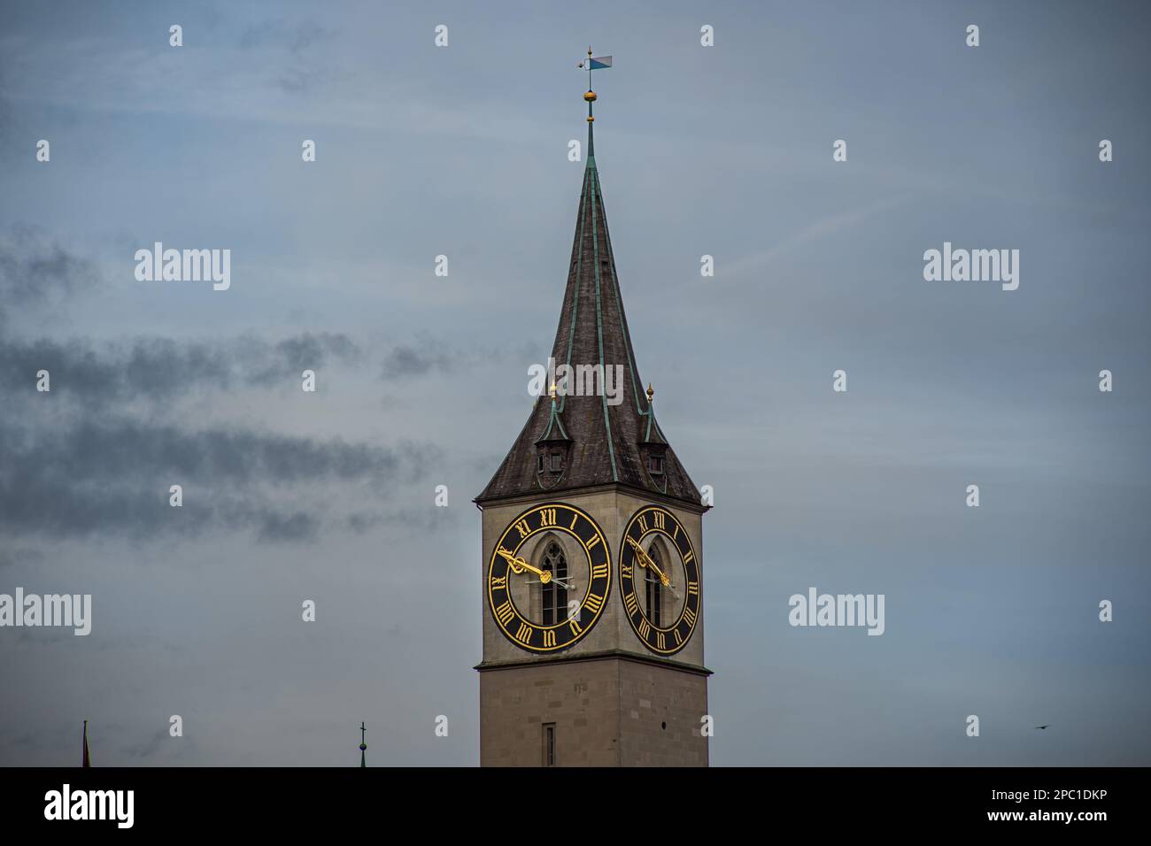 Medieval church clock tower or bell tower with a large analog clock ...