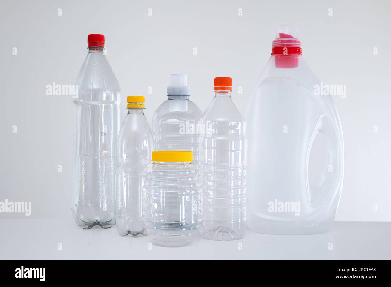 Variety of empty transparent plastic bottles without a label, ready to ...