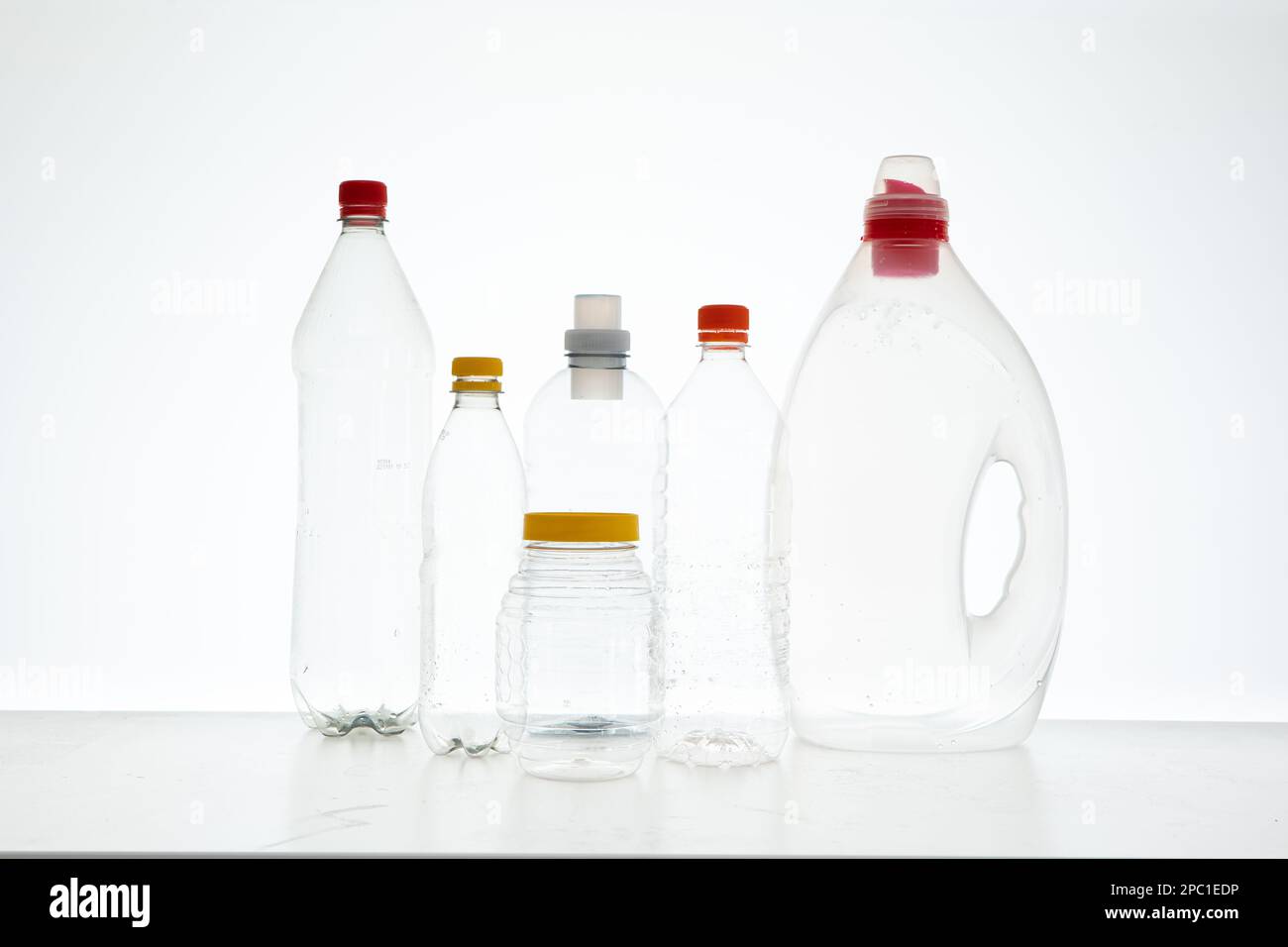 Variety of empty transparent plastic bottles without a label, ready to ...