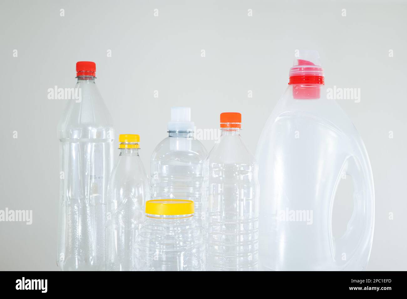 Variety of empty transparent plastic bottles without a label, ready to ...