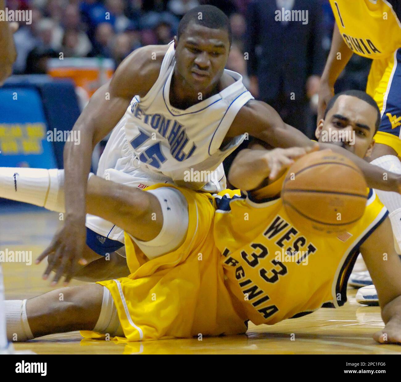 Seton Hall's Eugene Harvey, left, and West Virginia's Rob Summers ...