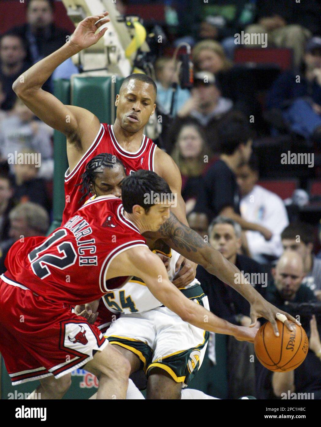 Chicago Bulls' Kirk Hinrich (12) swats the ball away from Seattle ...