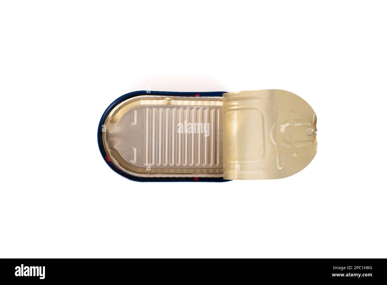 Empty and opened clean metal tin can on a white surface. Close up top ...