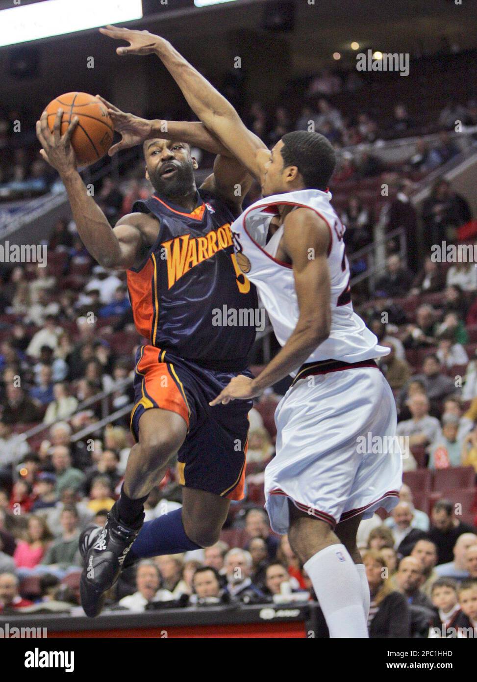 Golden State Warriors' Baron Davis tries to get by Philadelphia 76ers ...