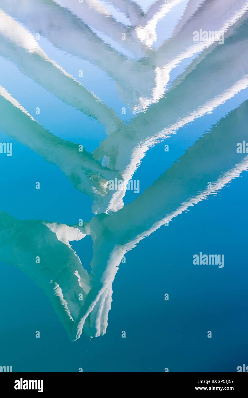 reflection of part of Building Bridges sculpture by artist Lorenzo ...