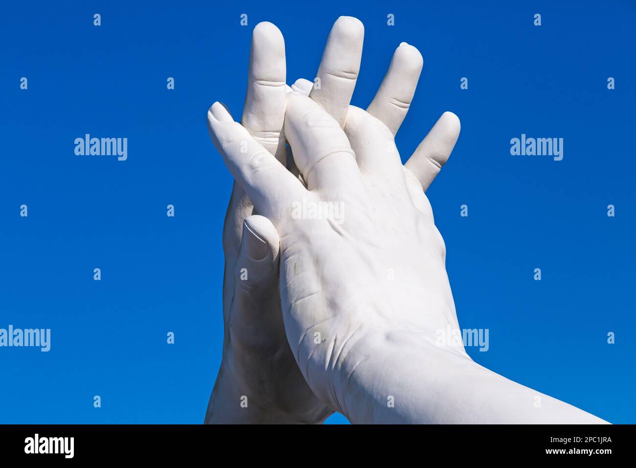 part of Building Bridges sculpture by artist Lorenzo Quinn depicting ...