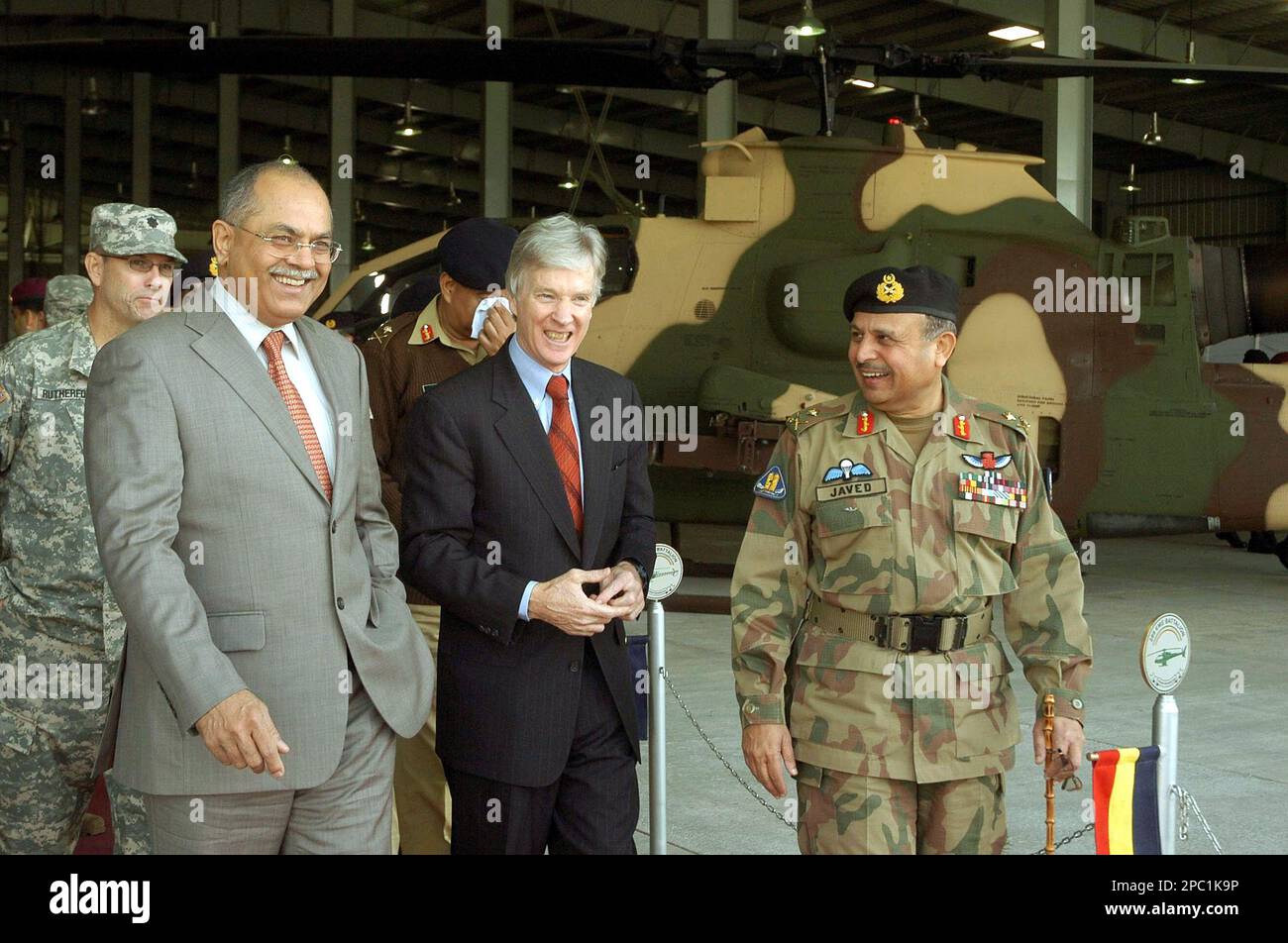 US Ambassador to Pakistan Ryan Crocker, center, flanked by Pakistani ...