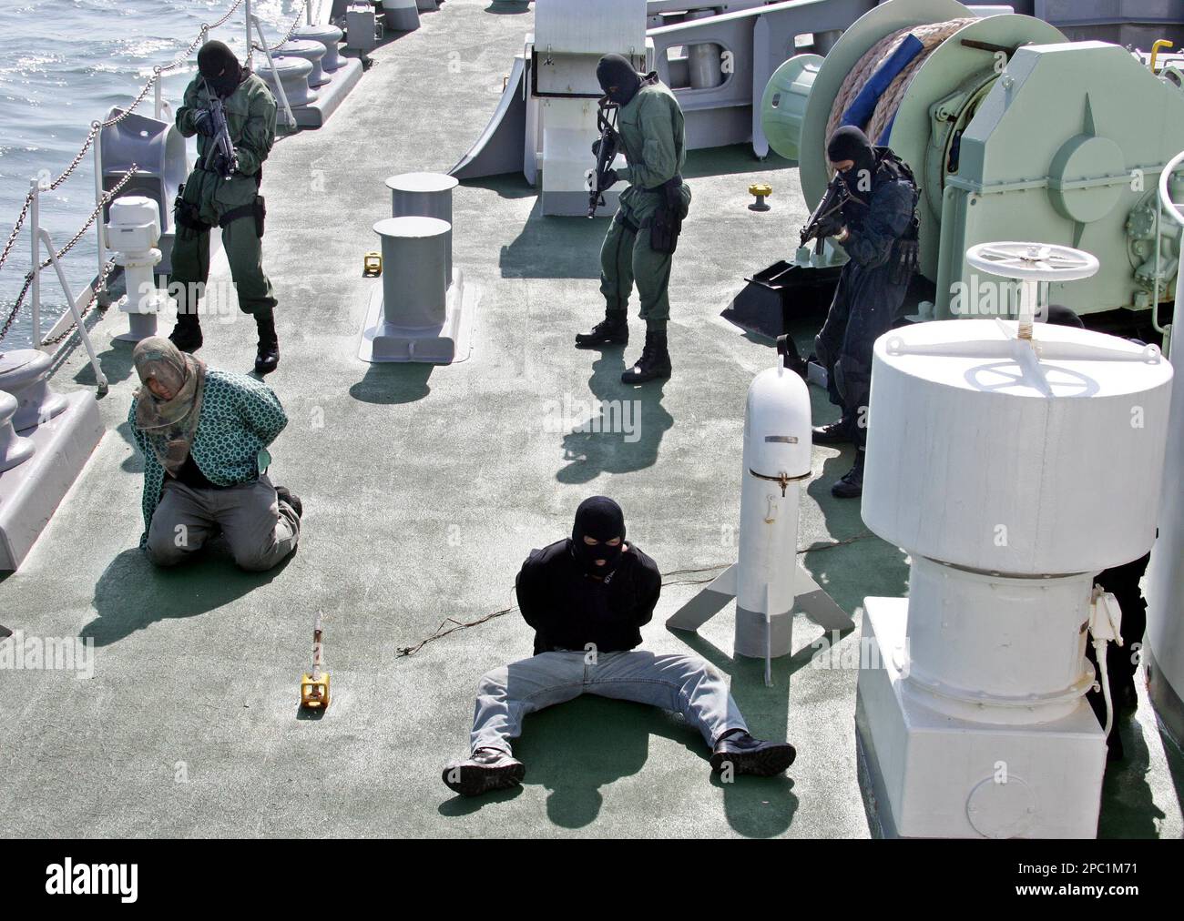 Malaysian police amphibious assault unit personnel arrest the hijackers ...