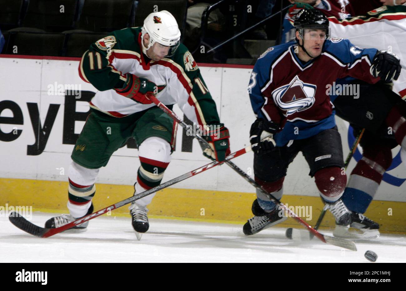 Minnesota Wild left winger Pascal Dupuis, left, gets called for ...