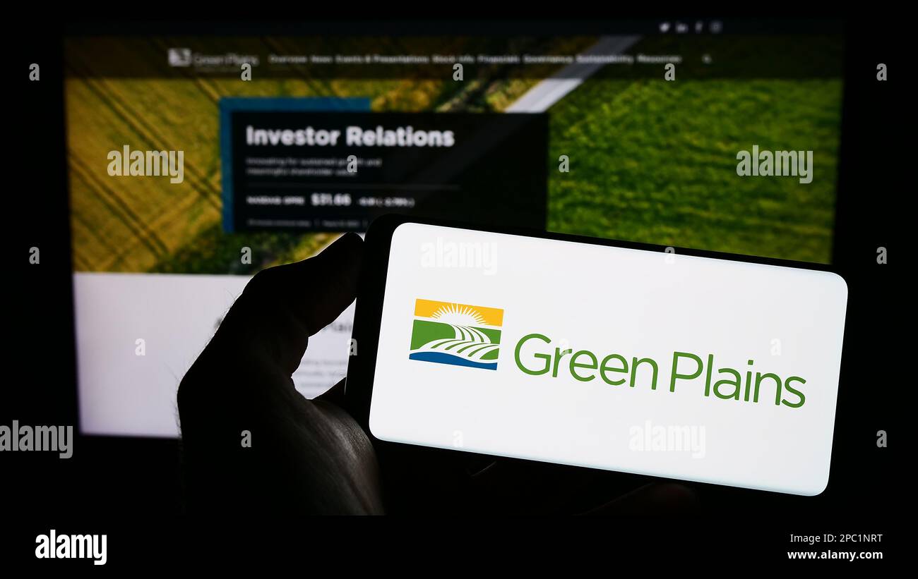 Person holding cellphone with logo of US ethanol company Green Plains ...